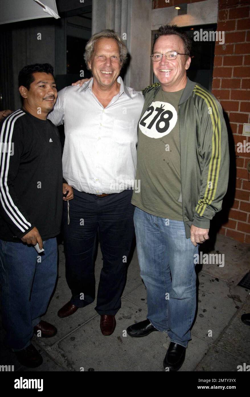 Tom Arnold quickly pulls up a seat with Steve Tisch and his family at ...