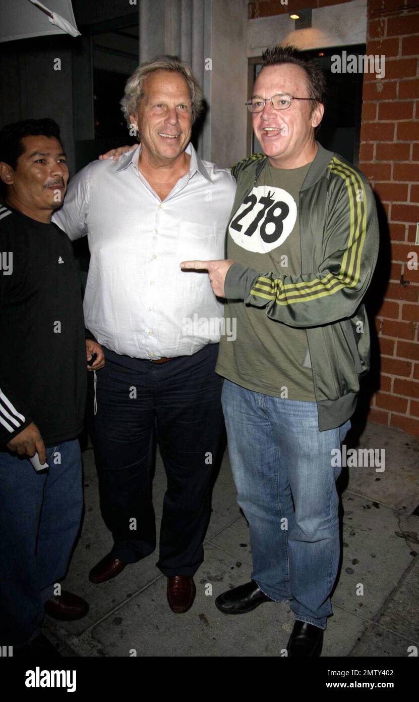 Tom Arnold quickly pulls up a seat with Steve Tisch and his family at ...