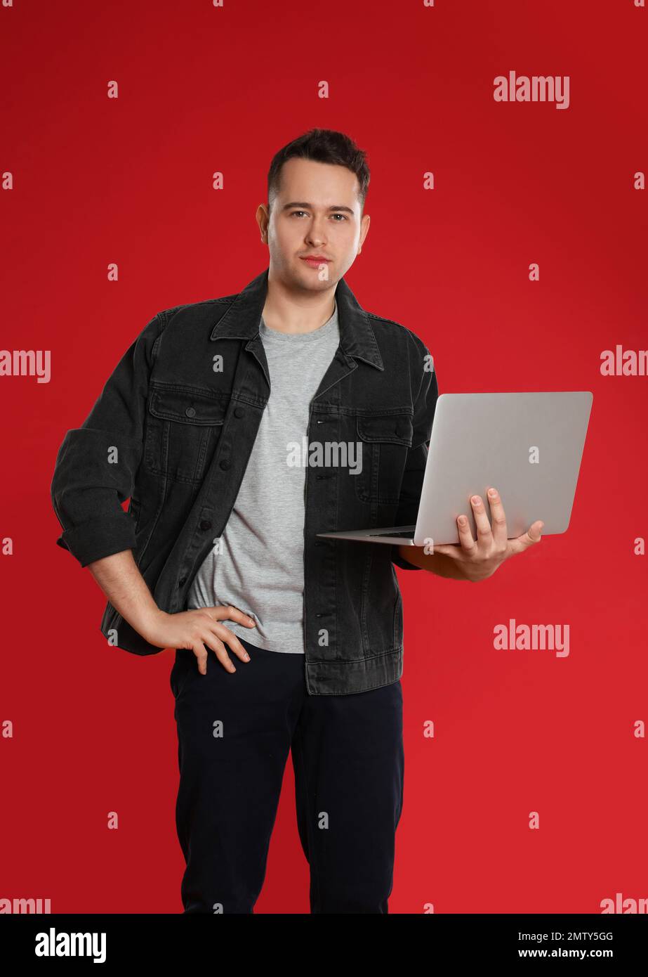 Red laptop studio portrait hi-res stock photography and images - Alamy