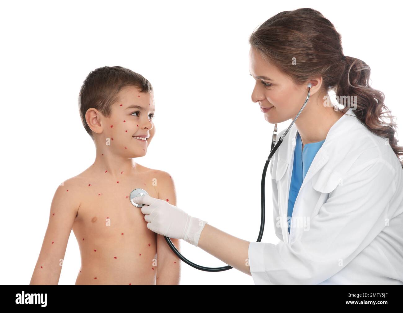 Doctor examining little boy with chickenpox on white background ...