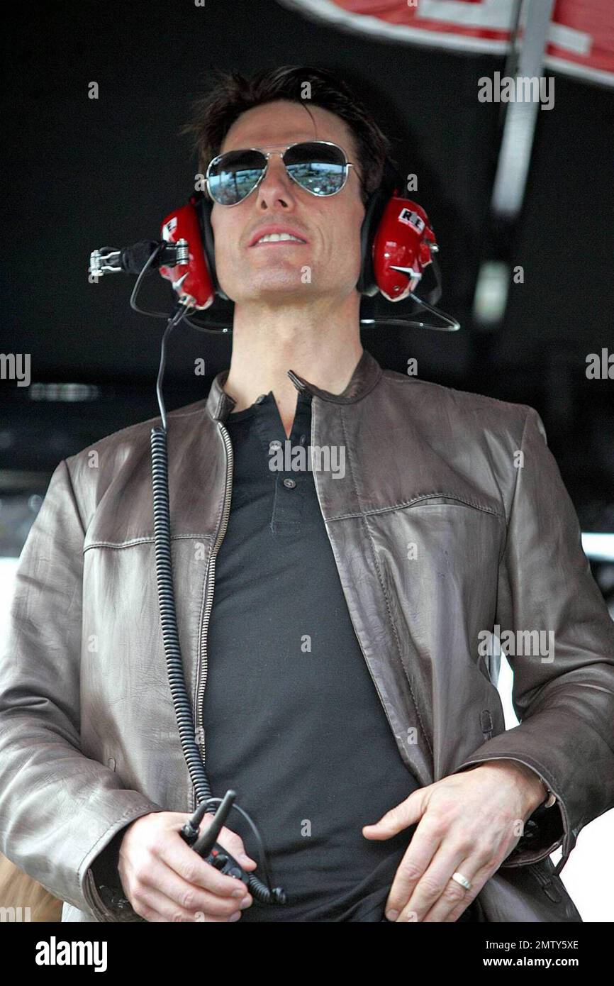 Actor Tom Cruise climbs into Jeff Gordon's pit box where he watches the ...