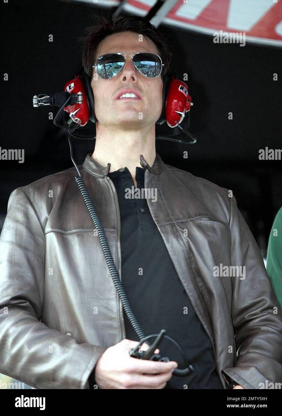 Actor Tom Cruise climbs into Jeff Gordon's pit box where he watches the ...
