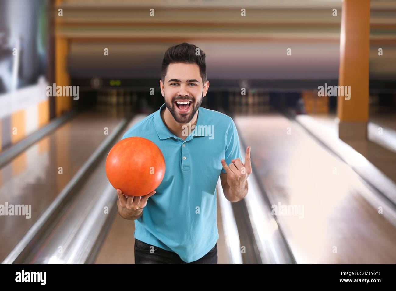 Man holding bowling ball in hi-res stock photography and images - Alamy