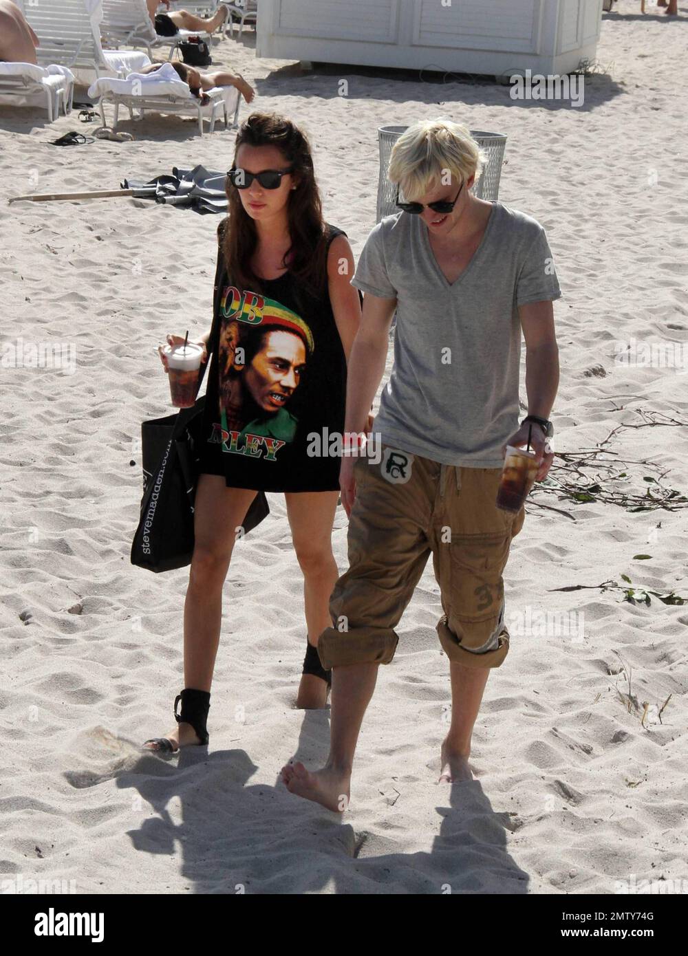 Tom Felton and his girlfriend Jade Gorden relax by the pool and ...