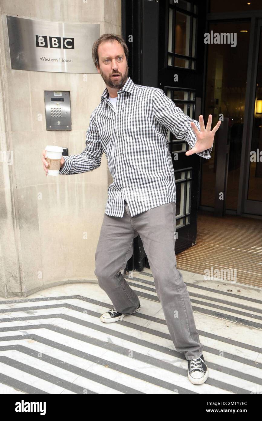 Actor and comedian Tom Green hams it up for the cameras while carrying ...