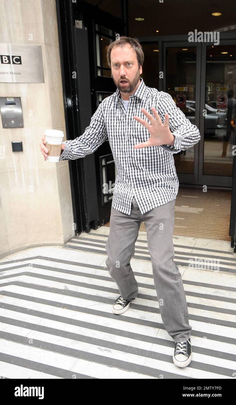 Actor and comedian Tom Green hams it up for the cameras while carrying ...