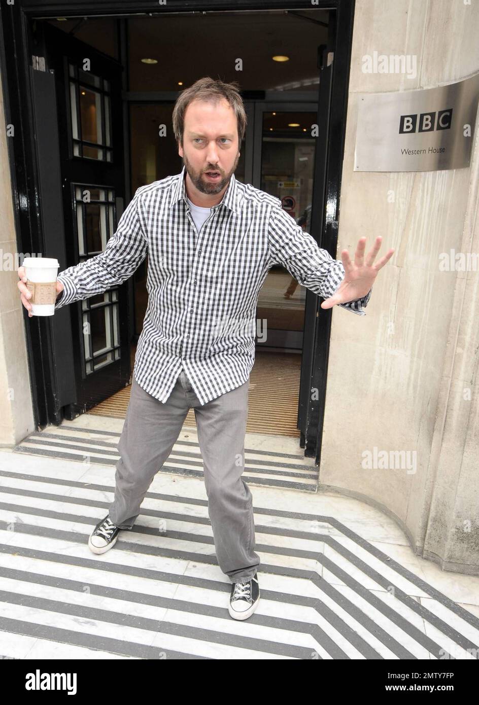 Actor and comedian Tom Green hams it up for the cameras while carrying ...
