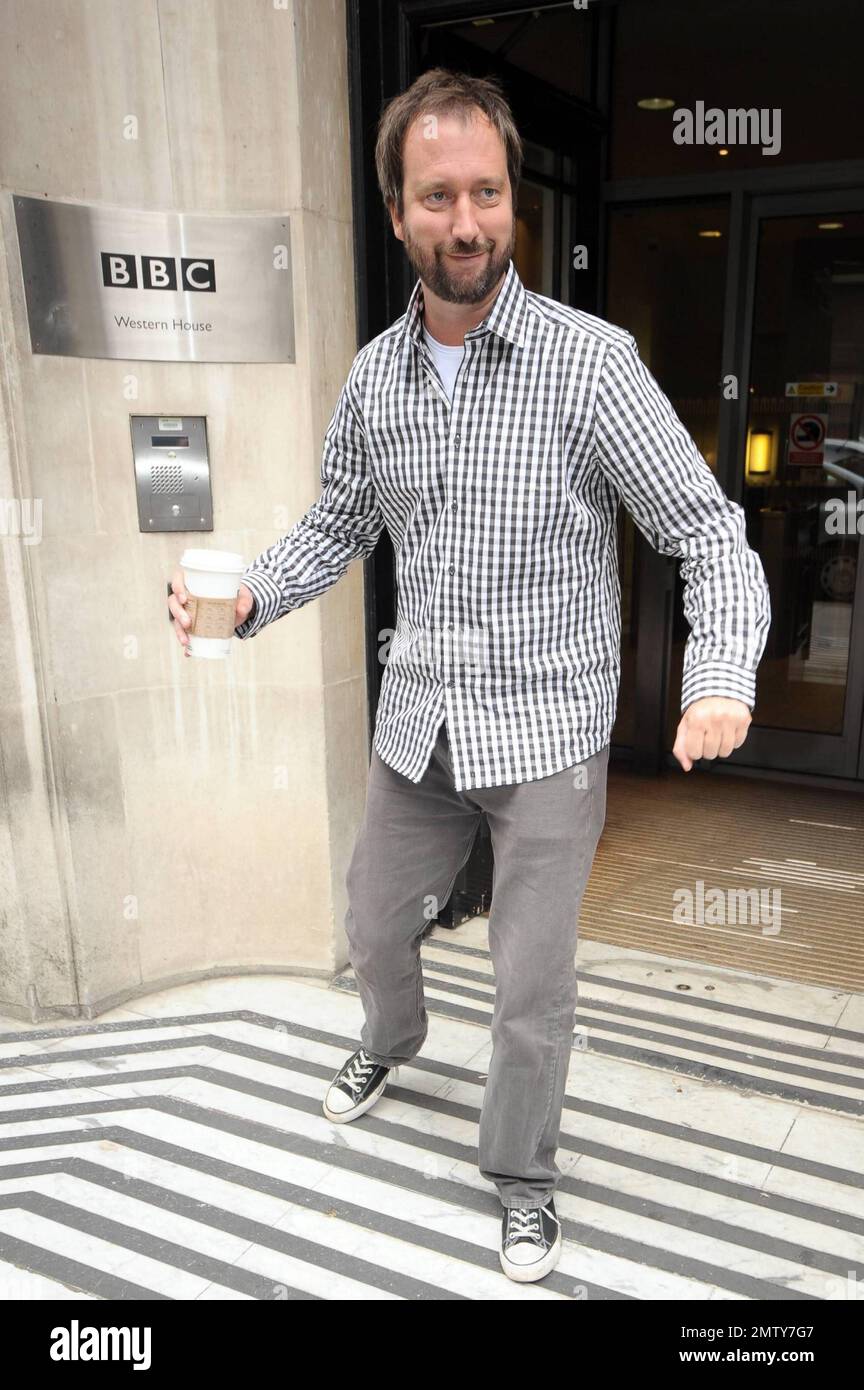 Actor and comedian Tom Green hams it up for the cameras while carrying ...
