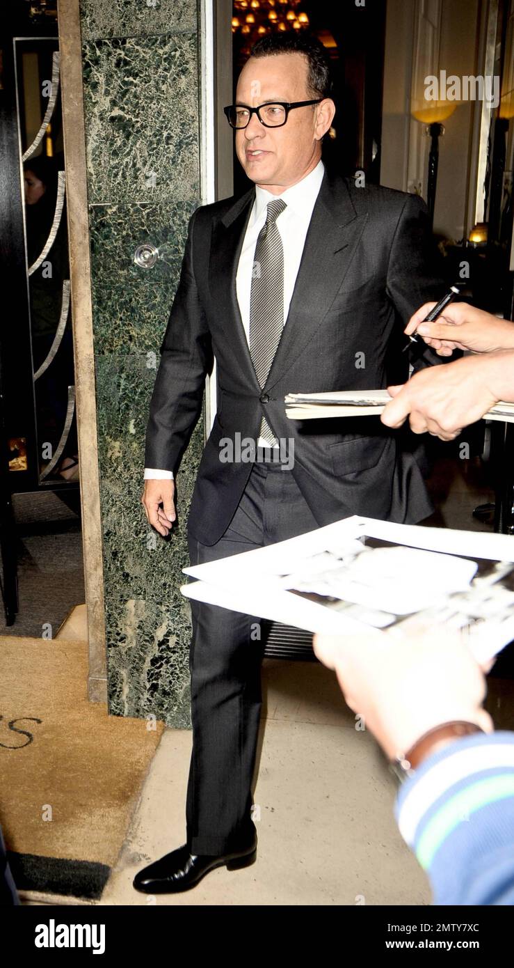 Actor Tom Hanks looks dapper in a black suit as he leaves his luxury ...