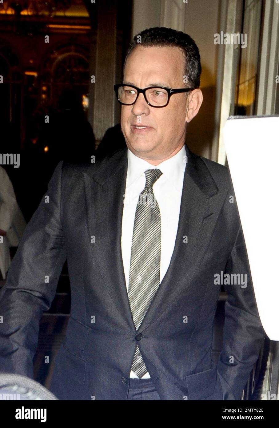 Actor Tom Hanks looks dapper in a black suit as he leaves his luxury ...