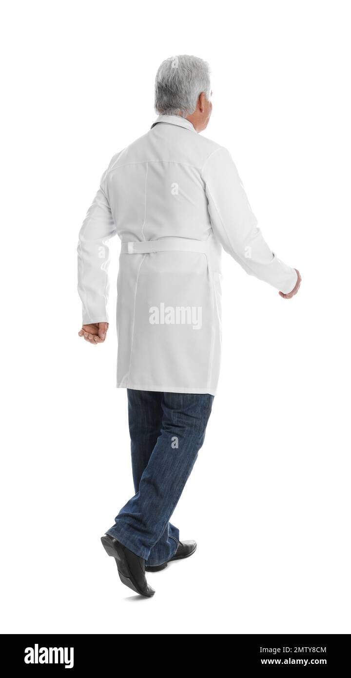 Senior doctor walking on white background, back view Stock Photo - Alamy
