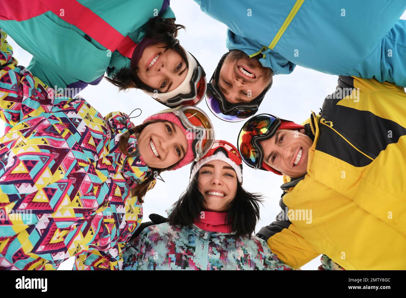 Group of friends joined in circle outdoors, bottom view Stock Photo - Alamy
