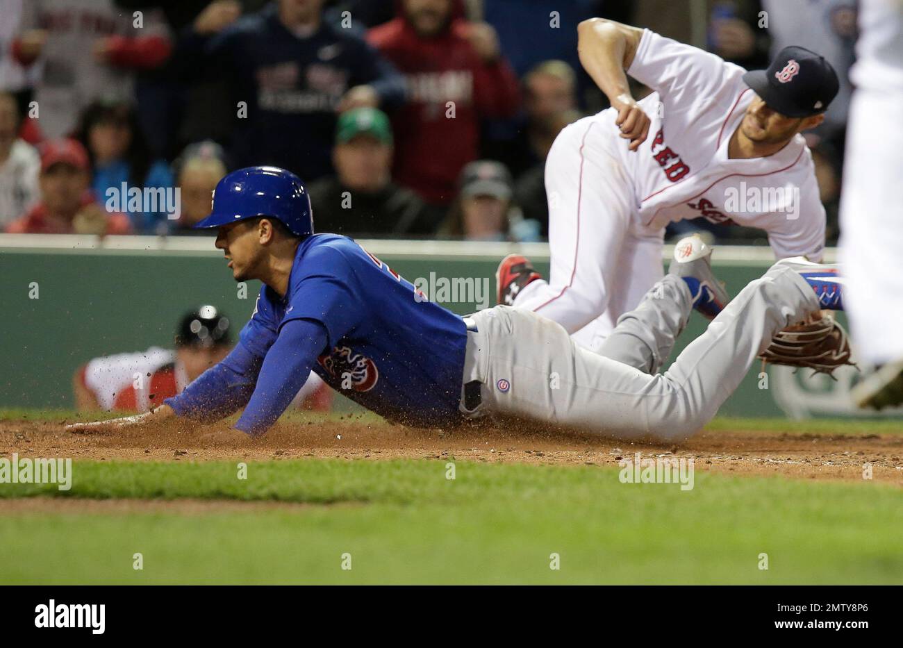 Chicago Cubs' Jon Jay, left, scores on a wild pitch as Boston Red Sox ...