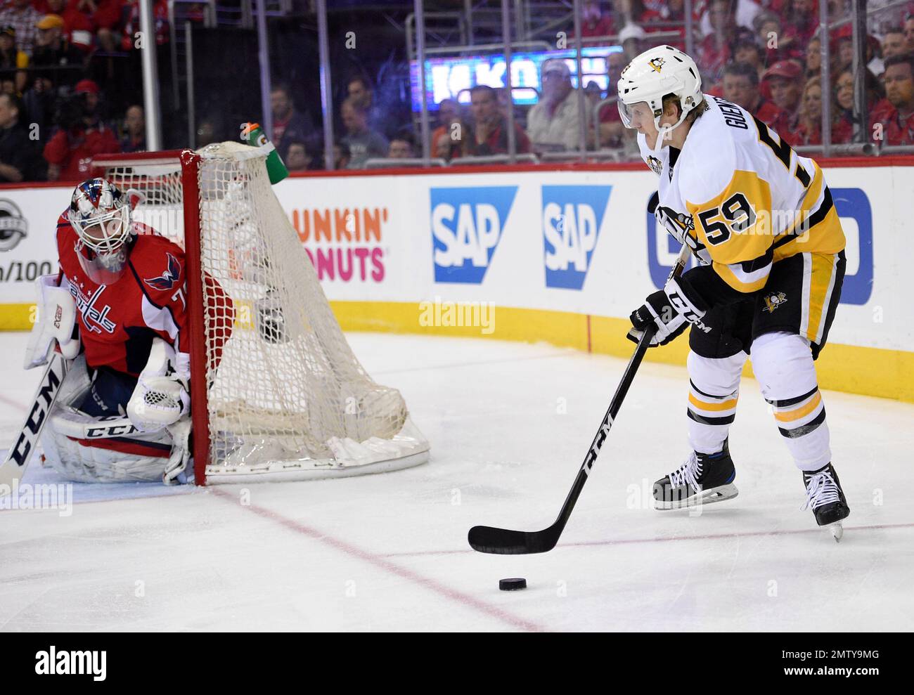 Pittsburgh Penguins center Jake Guentzel (59) skates with the puck ...