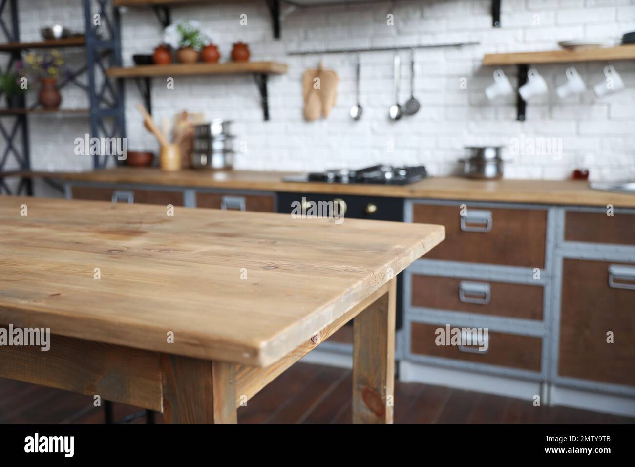 Empty wooden table in beautiful kitchen. Interior design Stock Photo ...