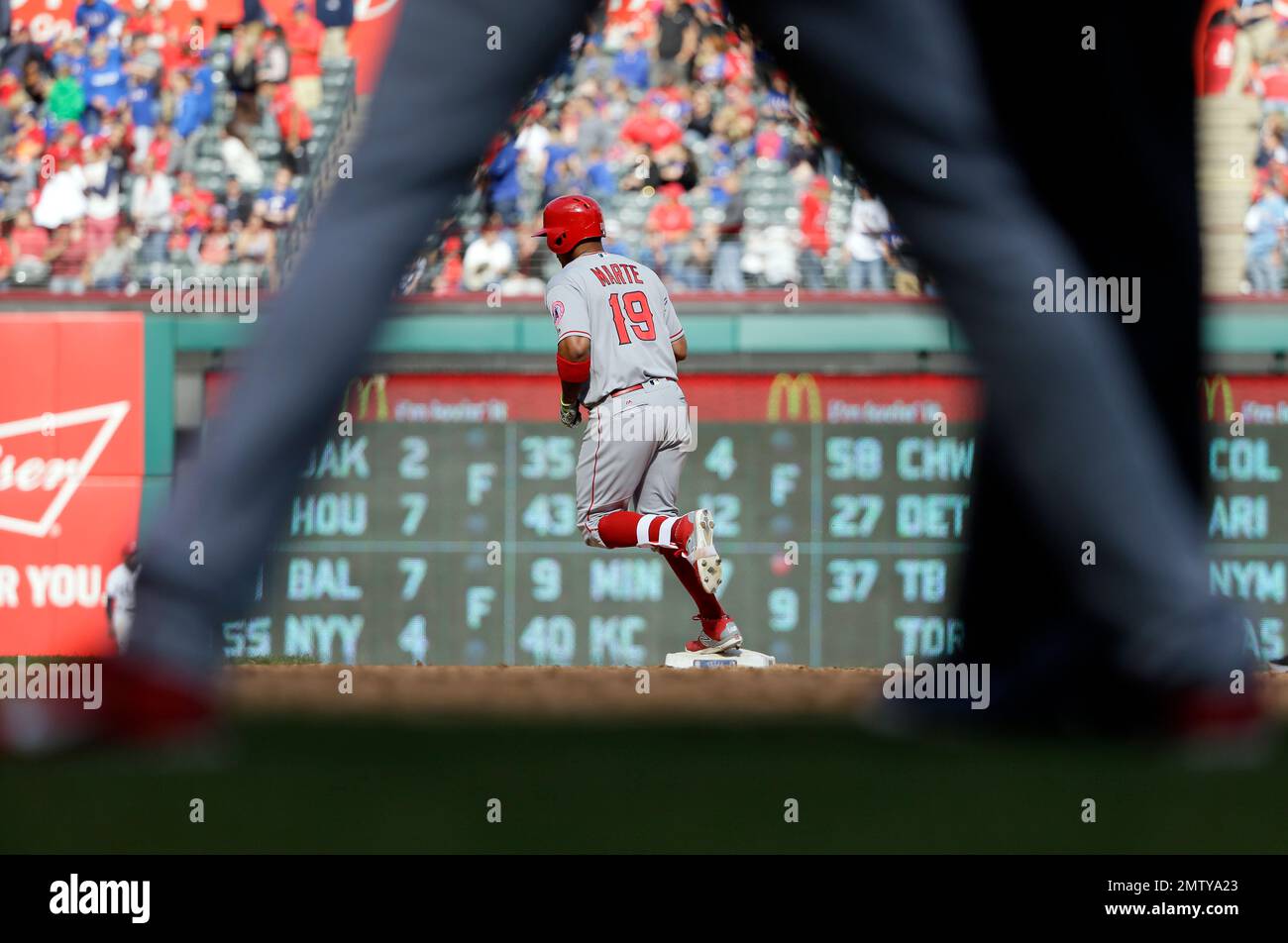 Los Angeles Angels infield coach Alfredo Griffin, legs shown, and ...