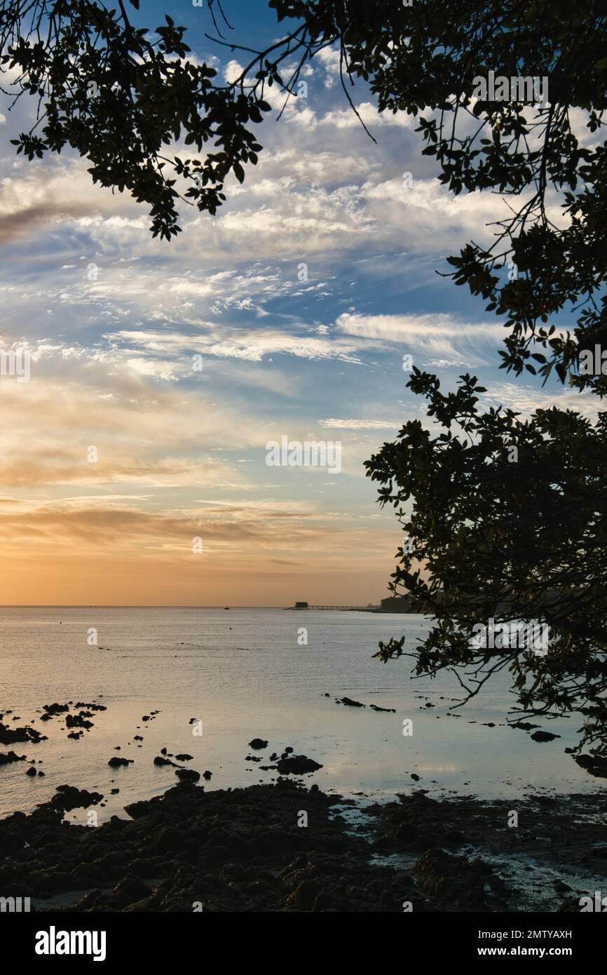 A mesmerizing view of the golden sunset over the sea Stock Photo - Alamy