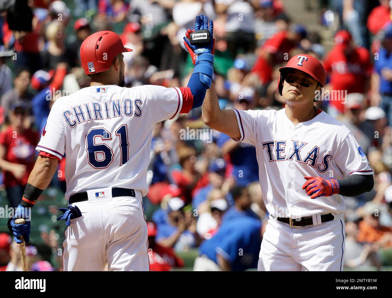 Texas Rangers' Robinson Chirinos (61) congratulates Shin-Soo Choo ...