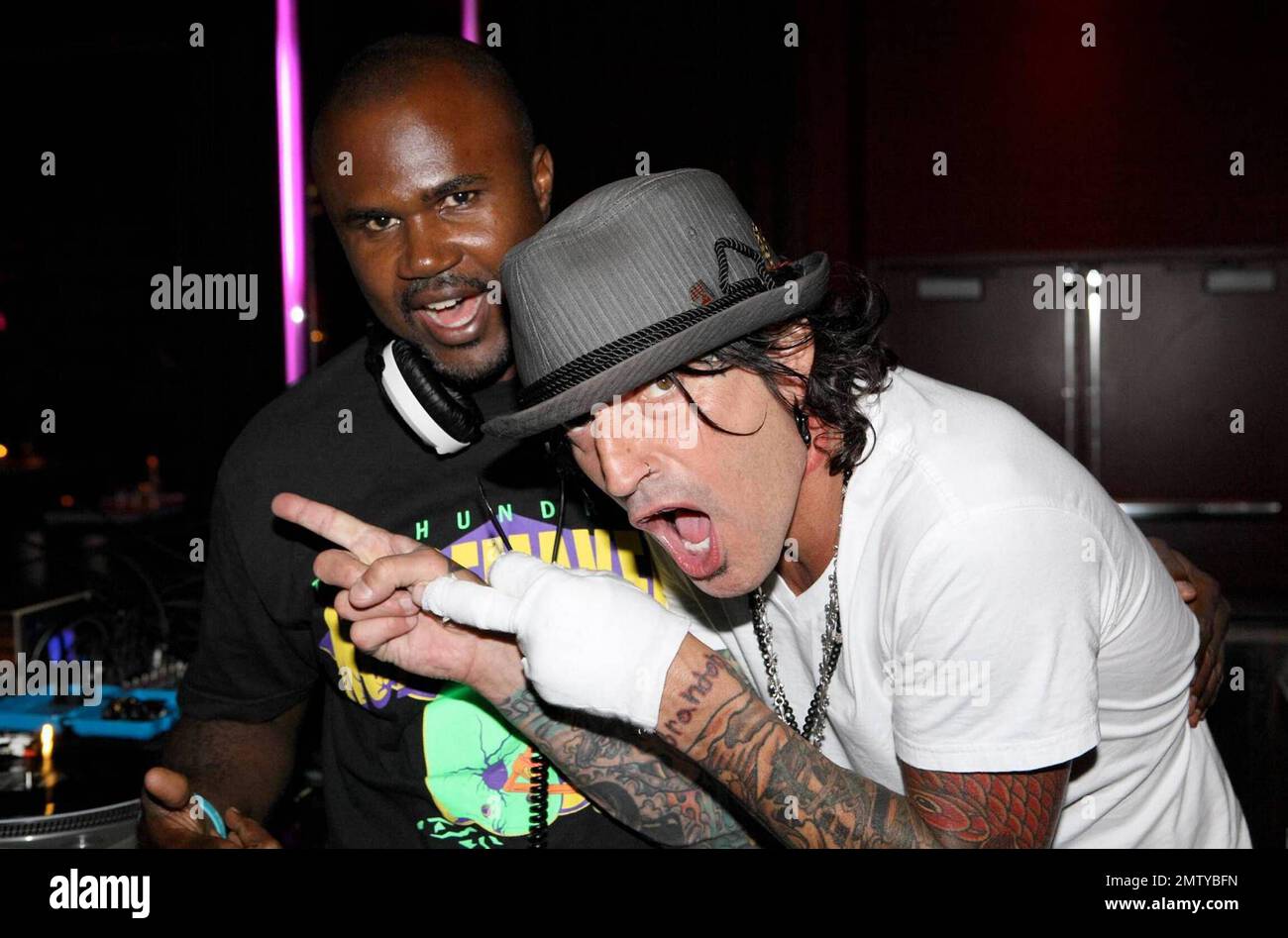 EXCLUSIVE!! Rocker Tommy Lee poses with DJ Kirk at Aura nightclub at ...