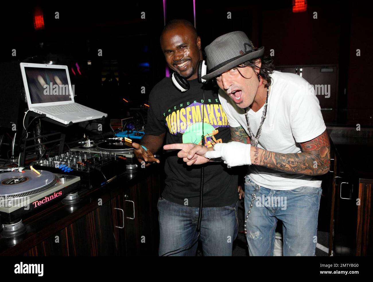 EXCLUSIVE!! Rocker Tommy Lee poses with DJ Kirk at Aura nightclub at ...