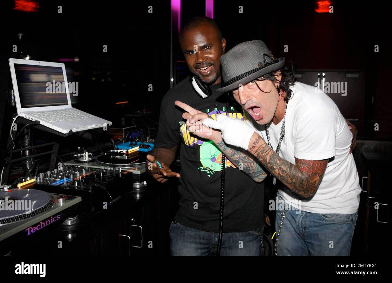 EXCLUSIVE!! Rocker Tommy Lee poses with DJ Kirk at Aura nightclub at ...