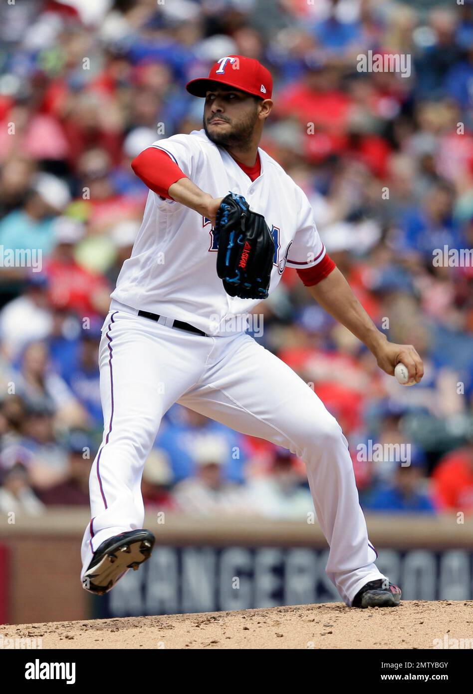 Texas Rangers' Martin Perez throws to the Los Angeles Angels in the ...
