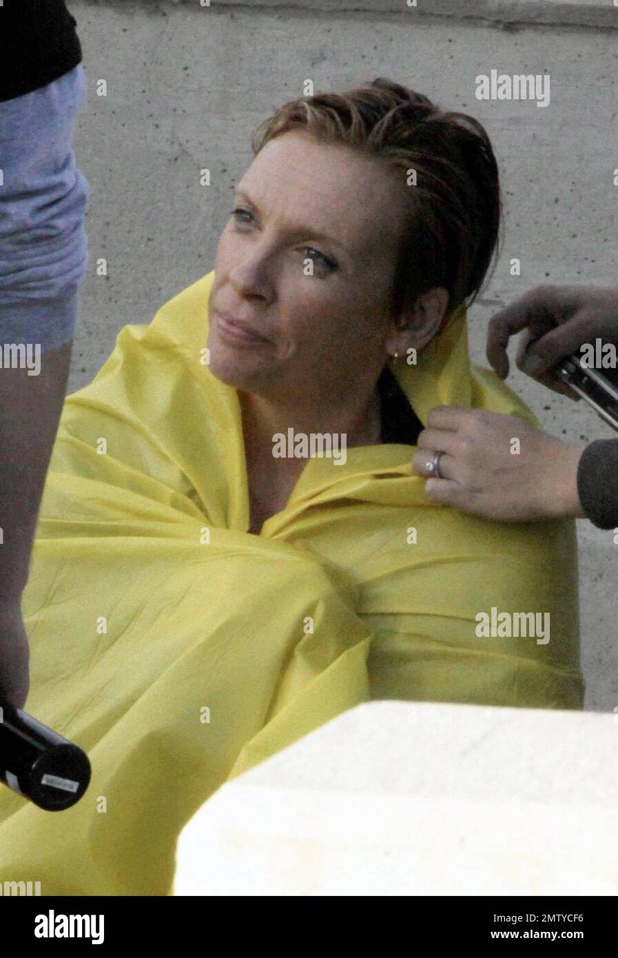 EXCLUSIVE!! Toni Collette covers up with a yellow tarp as she has some ...