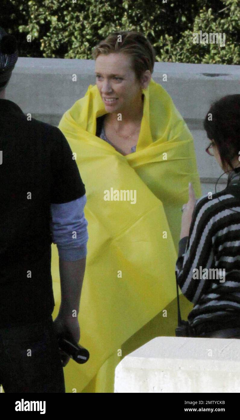 EXCLUSIVE!! Toni Collette covers up with a yellow tarp as she has some ...