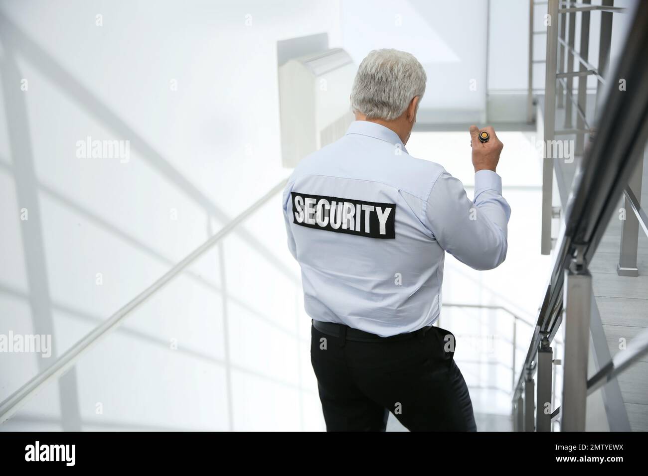 Man security guard flashlight hi-res stock photography and images - Alamy
