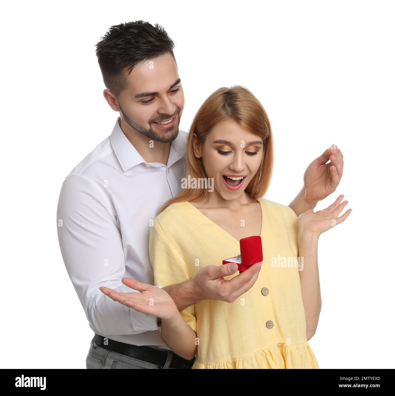 Man with engagement ring making marriage proposal to girlfriend on ...