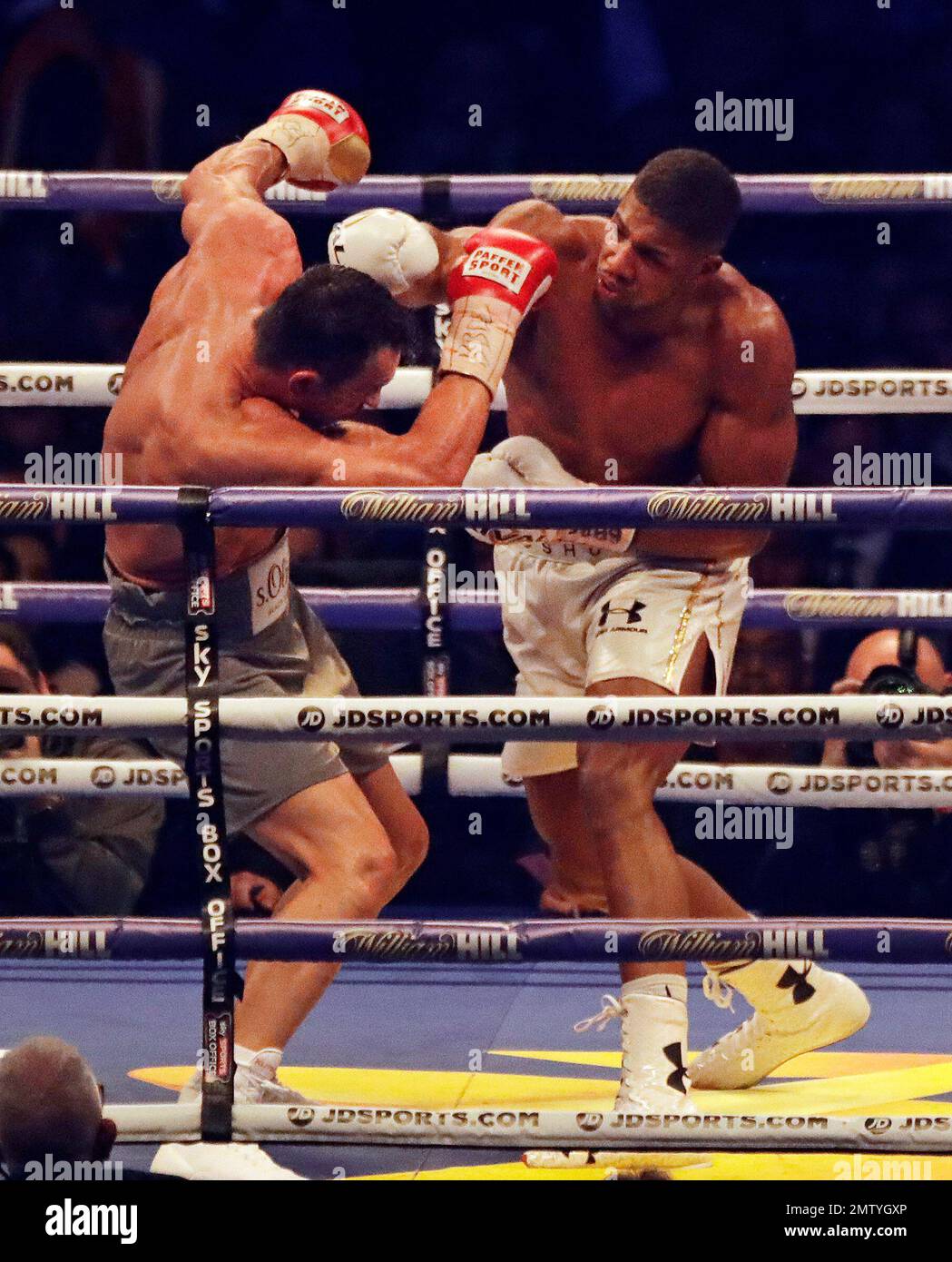 British boxer Anthony Joshua, right, fights Ukrainian boxer Wladimir ...