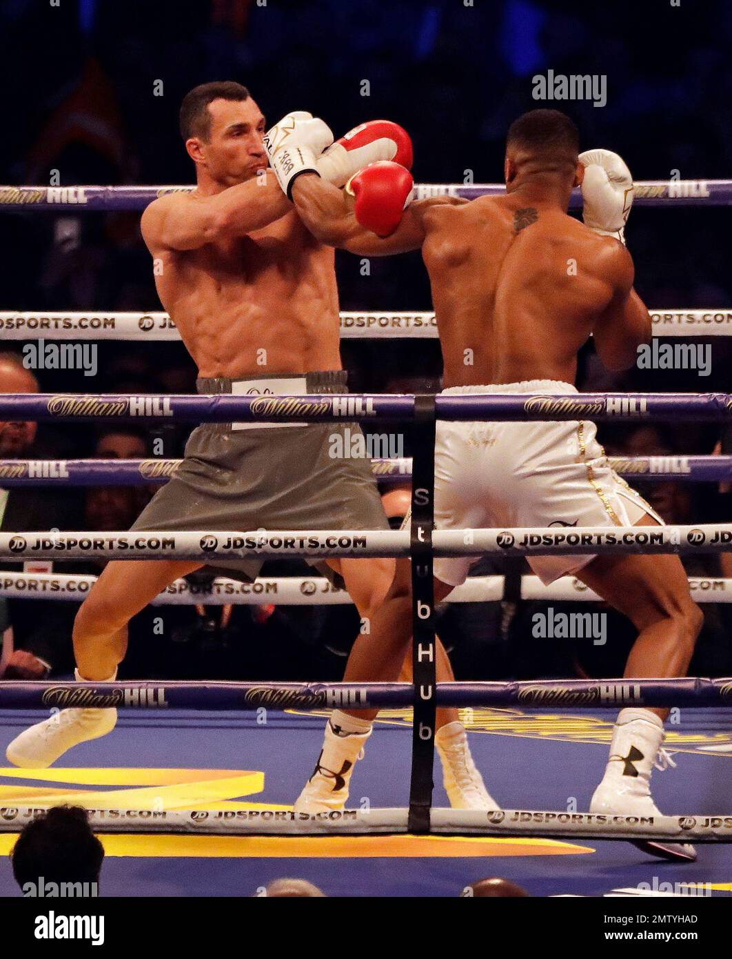 British boxer Anthony Joshua, right, fights Ukrainian boxer Wladimir ...