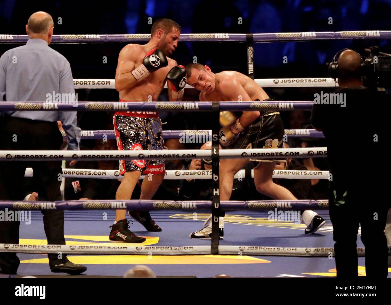 Romanian boxer Viorel Simion, left, fights British boxer Scott Quigg in ...