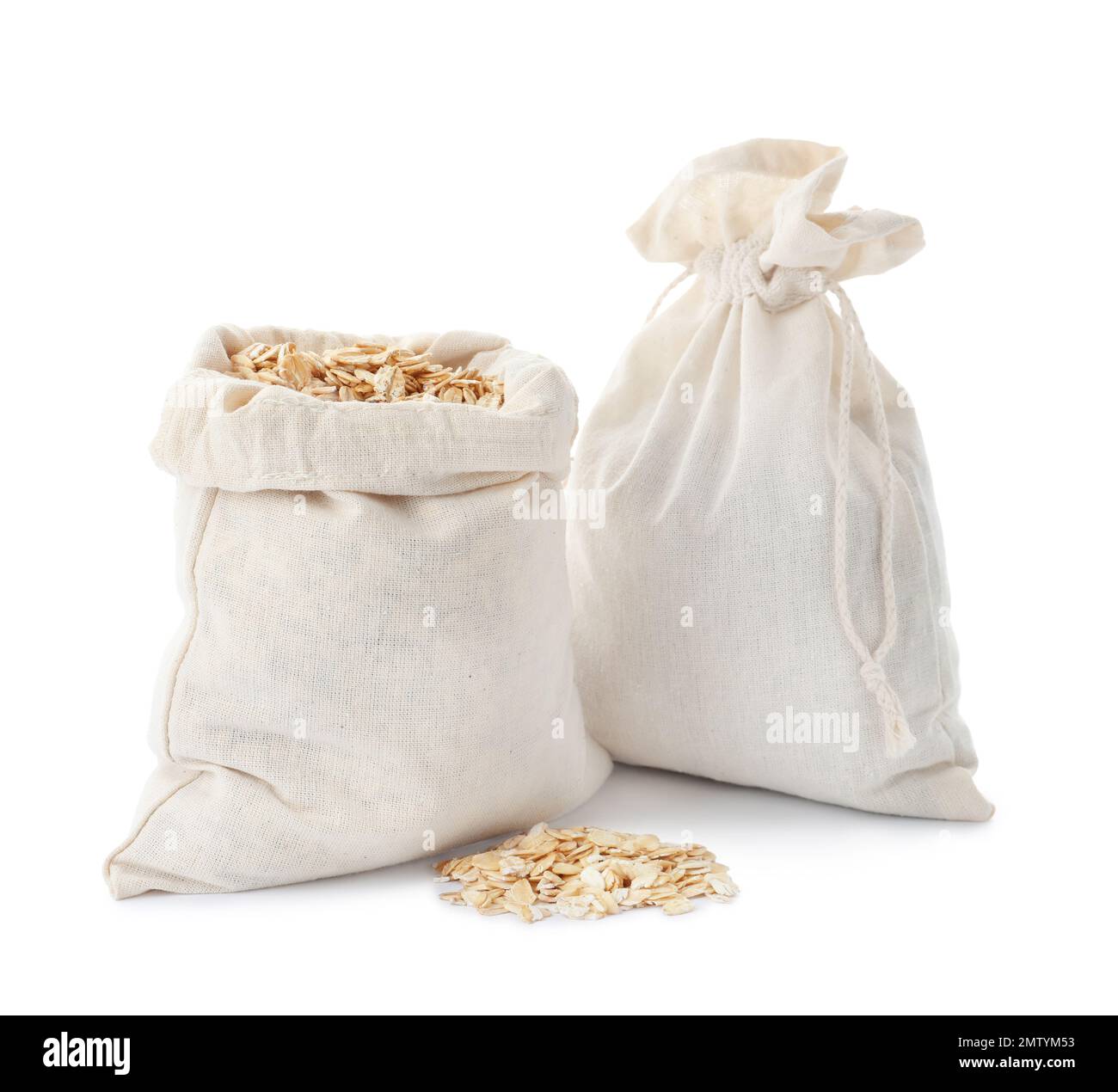 Cotton eco bags with oat flakes isolated on white Stock Photo - Alamy