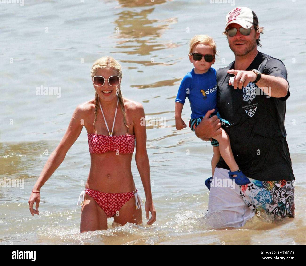 Actress and reality tv show star Tori Spelling looks painfully thin in a bikini whilst ...