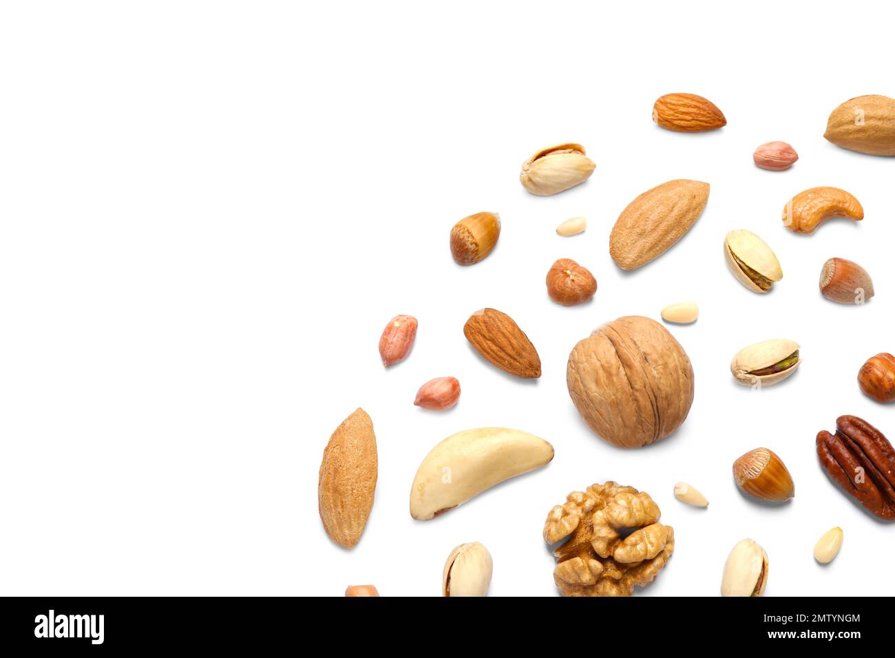 Different delicious nuts on white background, flat lay. Space for text ...
