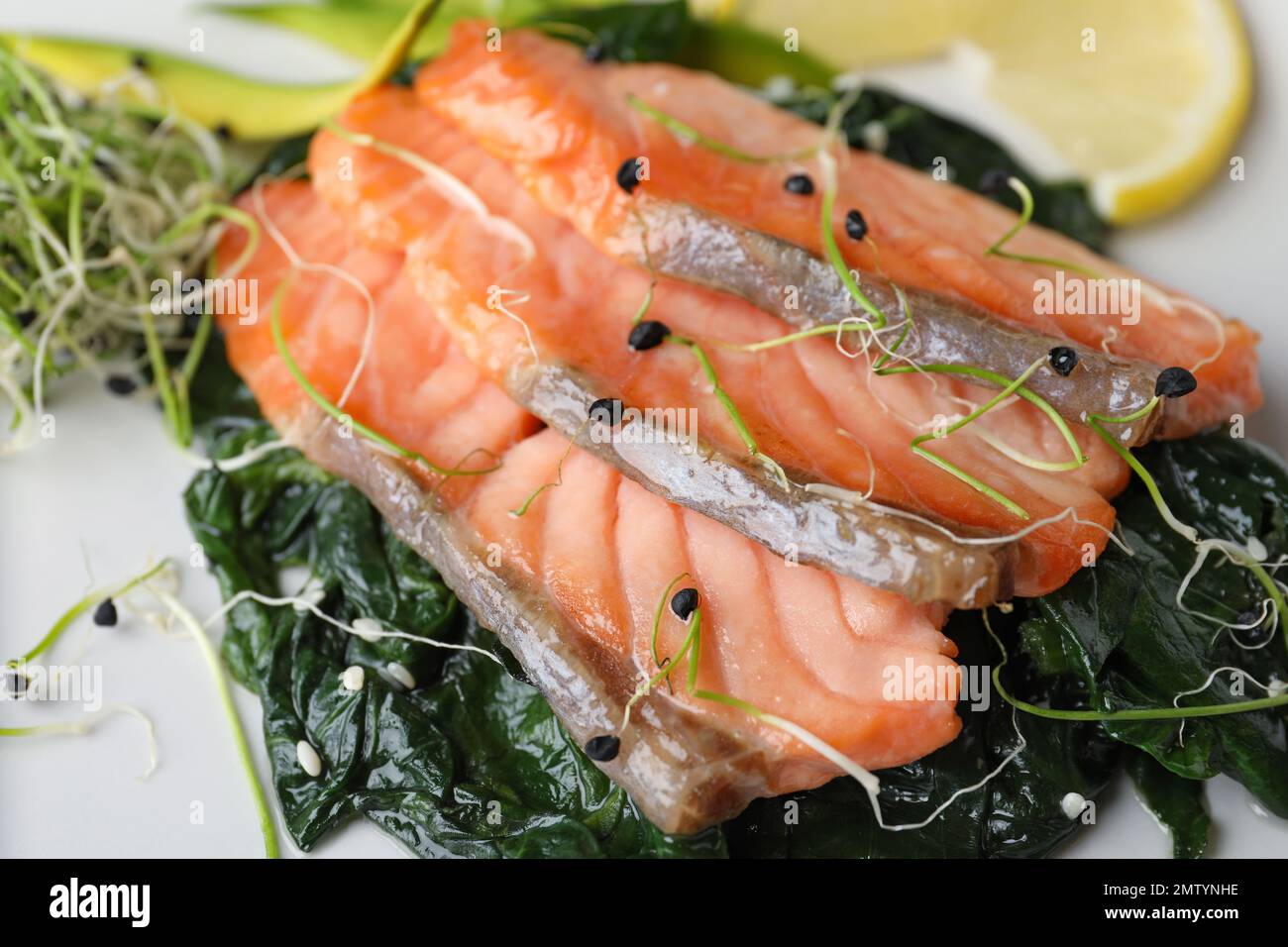 Tasty freshly cooked salmon with spinach, closeup Stock Photo - Alamy
