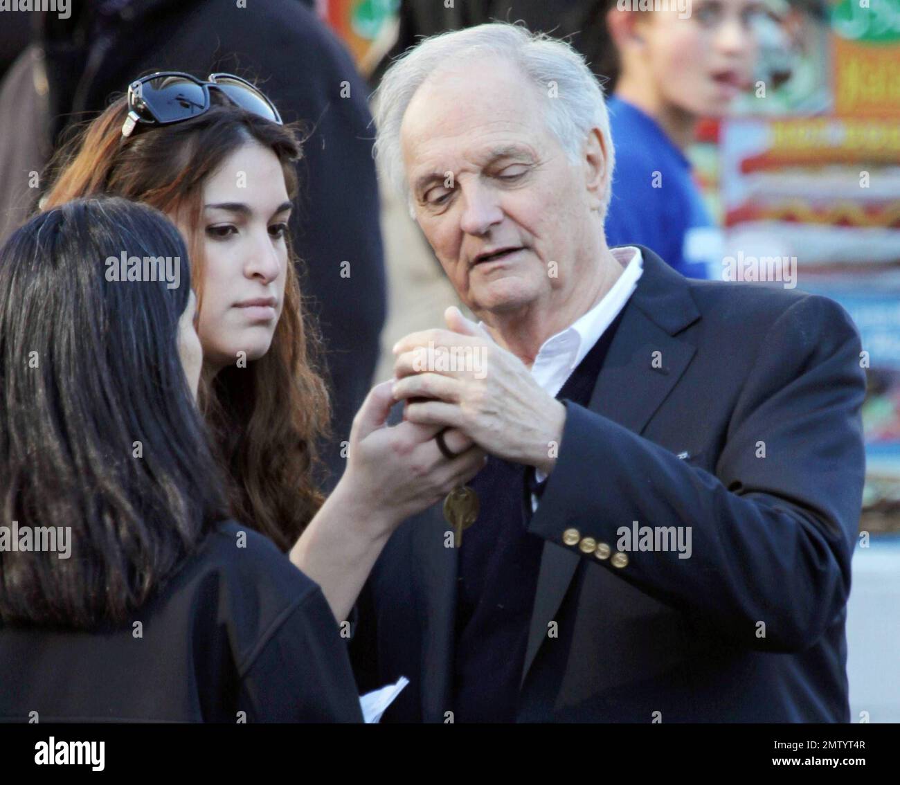 Actor Alan Alda show off fake blood on his head and is dragged by ...