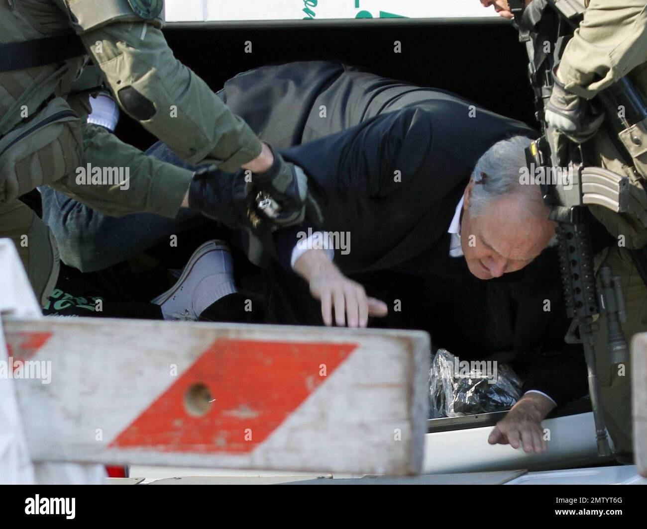 Actor Alan Alda show off fake blood on his head and is dragged by ...