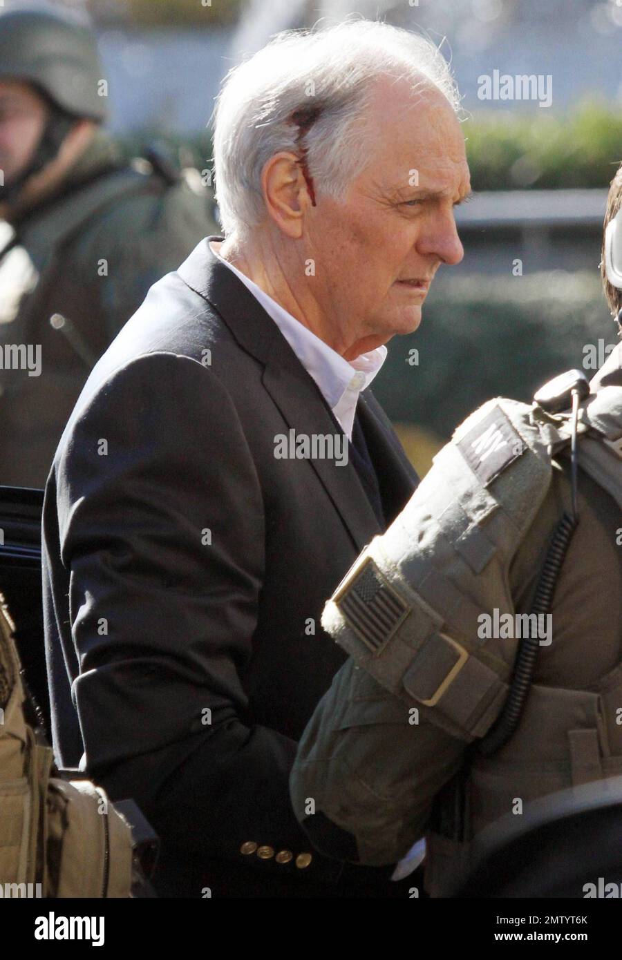 Actor Alan Alda show off fake blood on his head and is dragged by ...