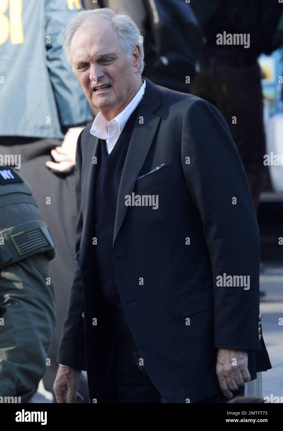 Actor Alan Alda show off fake blood on his head and is dragged by ...