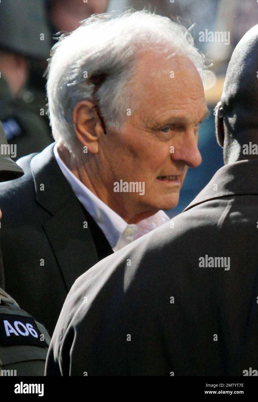 Actor Alan Alda show off fake blood on his head and is dragged by ...