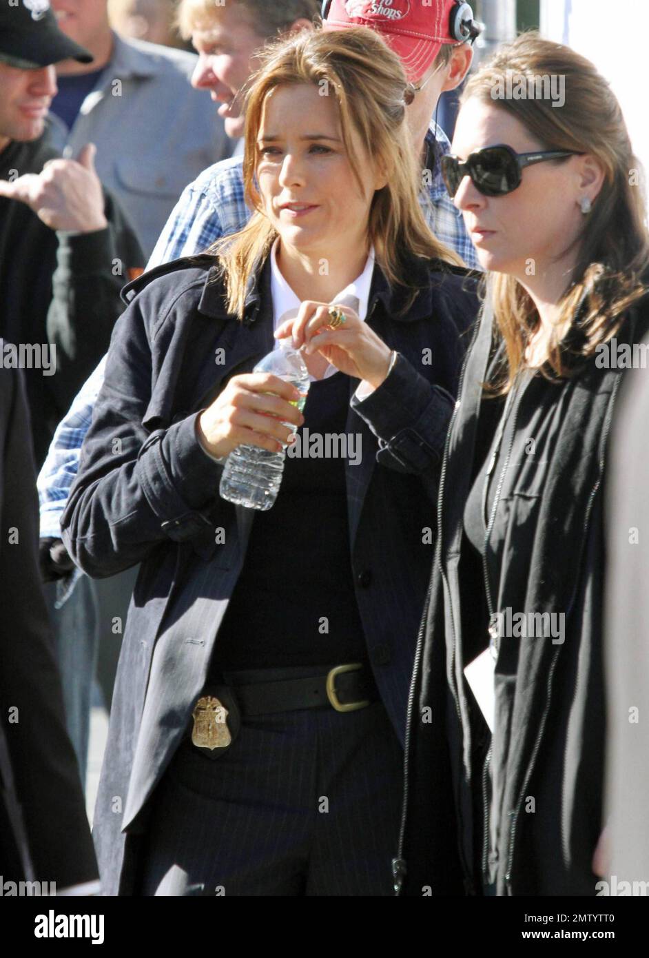 Actress Tea Leoni, who appears to play a police officer, points a prop ...