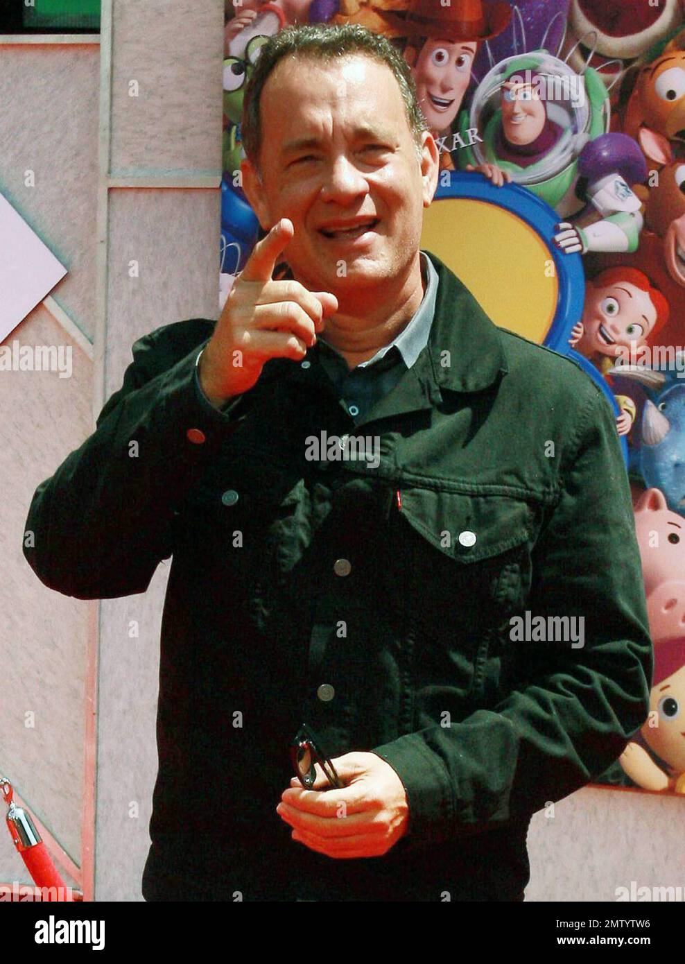 Tom Hanks walks the red carpet at the premiere of "Toy Story 3" held at ...