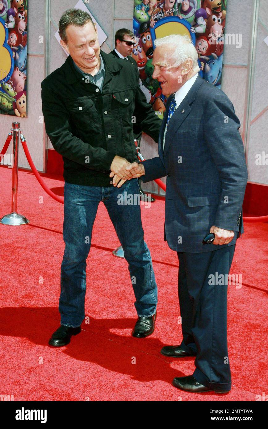 Tom Hanks shakes hands with former astronaut Buzz Aldrin on the red ...