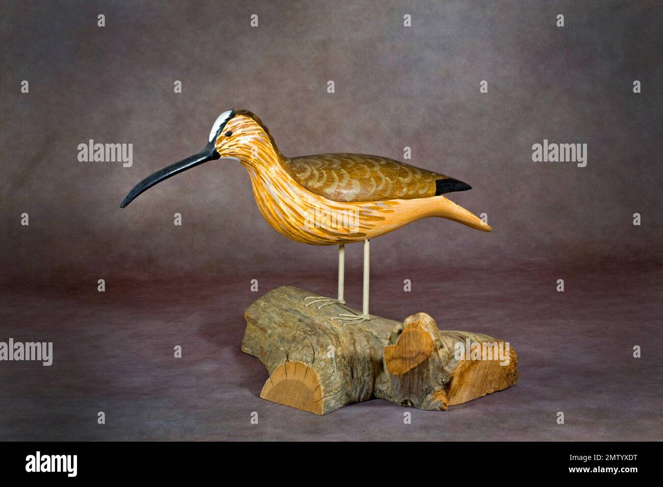 A hand carved, wooden Curlew mounted on driftwood, created by legendary ...