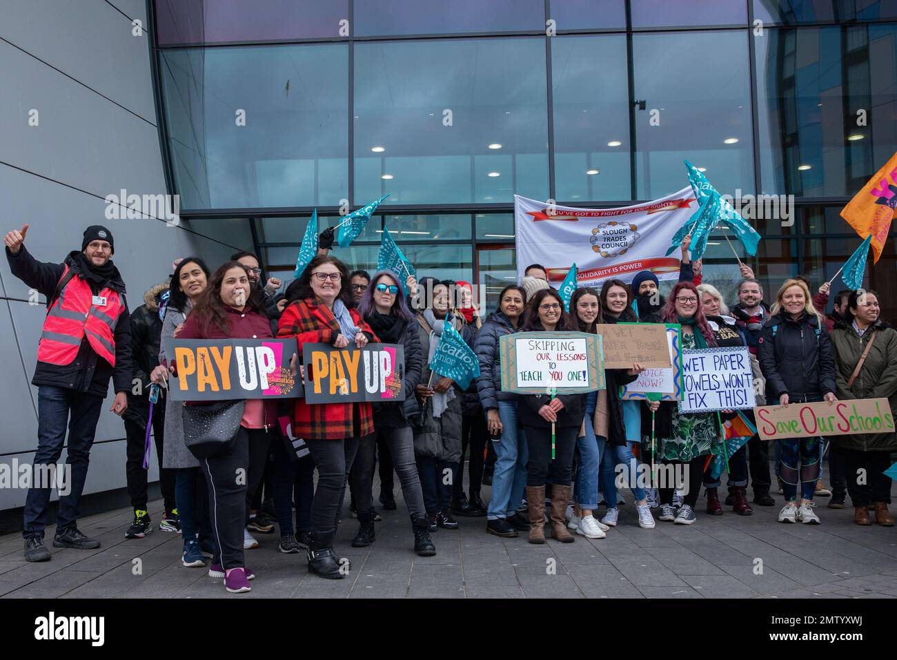 Slough, UK. 1st February, 2023. Local teachers pose for a photograph ...