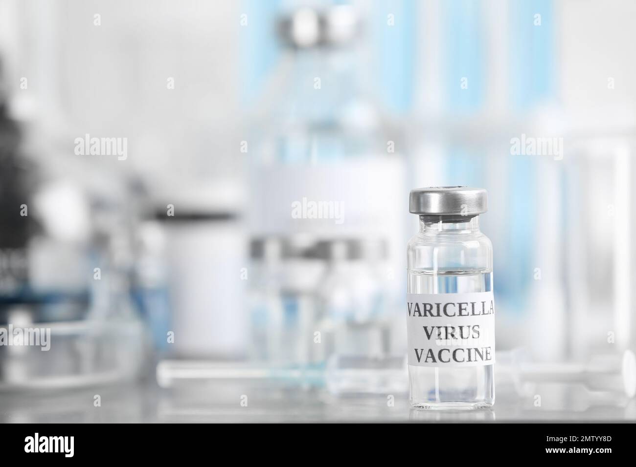 Chickenpox vaccine on table in laboratory, space for text. Varicella ...