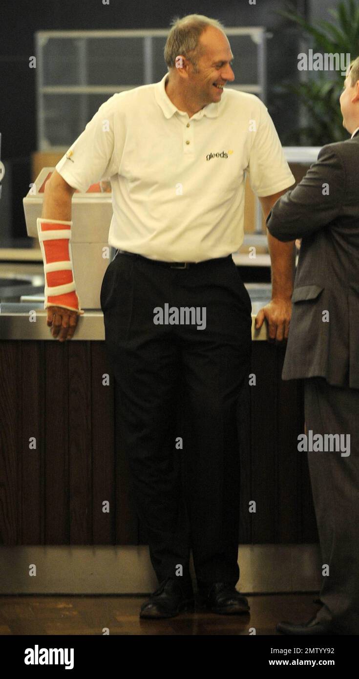 Rower and olympic gold medalist Sir Steven Redgrave wears a cast on his ...