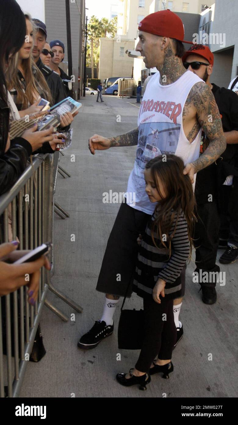 Blink-182 drummer Travis Barker greets fans and signs autographs as he ...
